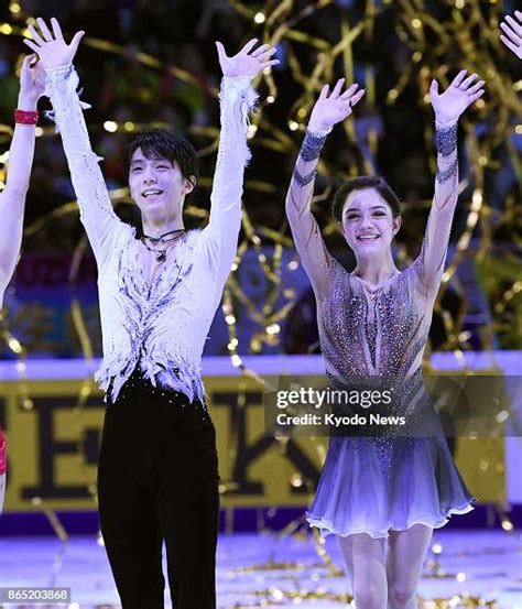 Yuzuru Hanyu Of Japan And Evgenia Medvedeva Of Russia Wave To The