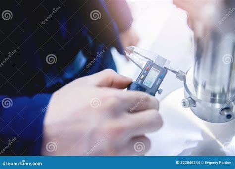 Engineer Checks Dimensions With Vernier Caliper Finish Detail After Metalworking On Cnc Machine