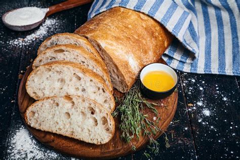 Sliced Homemade Italian Ciabatta Bread With Olive Oil On Dark Background Ciabatta Herbs Olive
