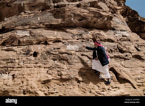 A World Authority On Thamudic Script Pointing Out The Writing And Rock