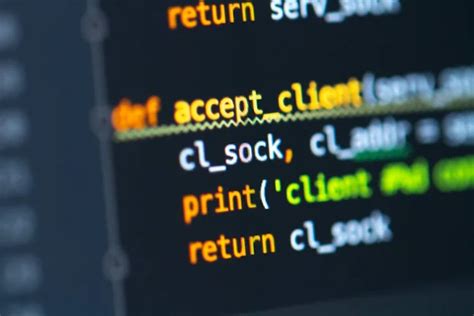 Software developer programming code on the screen of computer di ...