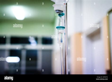 Intravenous Therapy Iv Infusion Set And Bottle On A Pole Liquid Saline