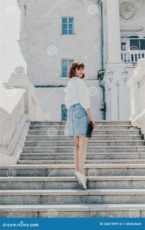 Woman Staircase City A Business Woman In A White Shirt And Denim Skirt
