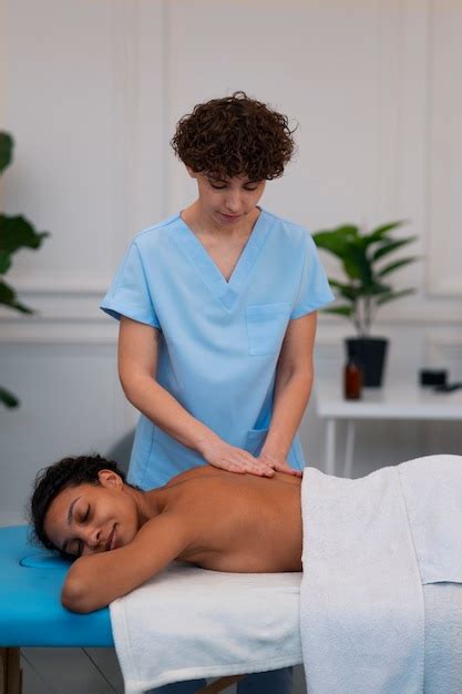 Premium Photo Woman Getting A Back Massage In A Rehabilitation Center