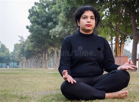 Young Indian Woman Practicing Yoga Outdoor In A Park Beautiful Girl