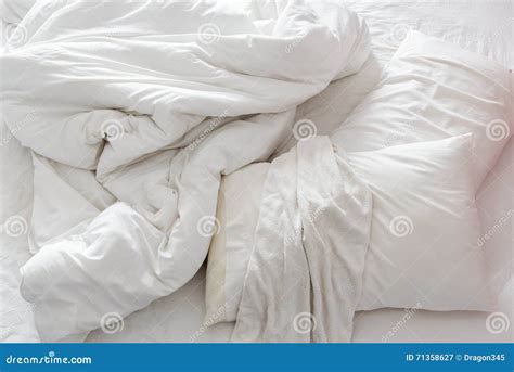 Top View Of An Unmade Bed In A Bedroom With Crumpled Bed Sheet Stock
