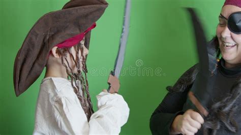 Pirates Getting Angry And Fighting With Cutlasses Isolated On Green