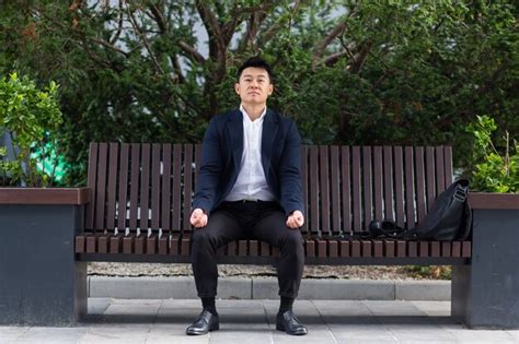 Premium Photo Asian Businessman Performing Breathing Exercises Trying