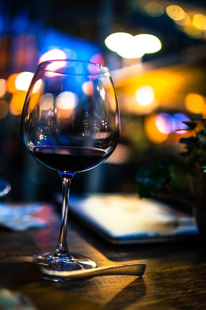 Premium Photo Close Up Of Wine Glass On Table