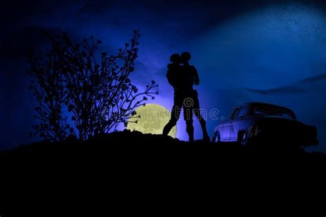 Silhouette Of Couple Kissing Under Full Moon Guy Kiss Girl Hand On