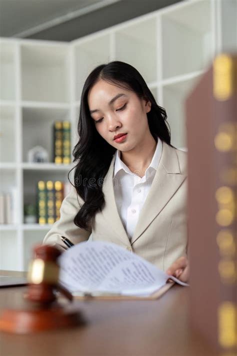 Professional Female Lawyer Working In Modern Office With Legal