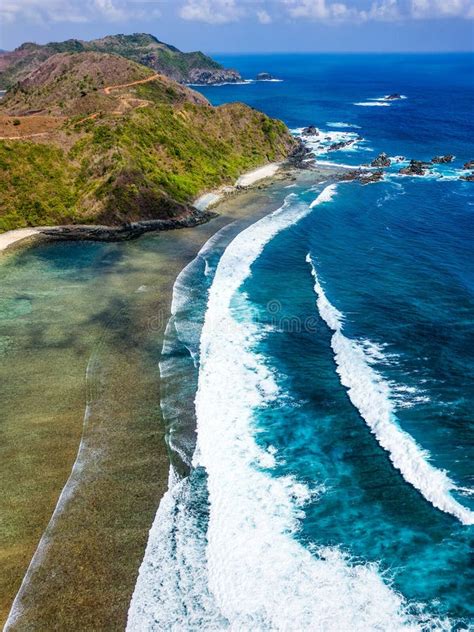 Aerial View Of Ocean Waves Breaking Over A Fringing Coral Reef Stock