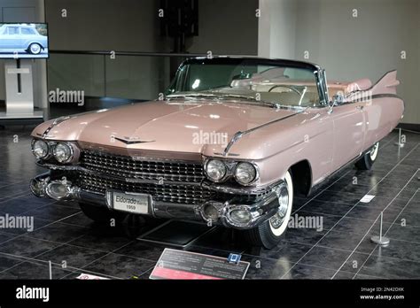 A Vintage Pink Cadillac Eldorado Car In The Toyota Motor Museum In