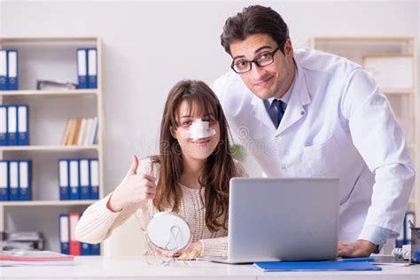The Male Doctor Talking To Patient With Nose Operation Surgery Stock
