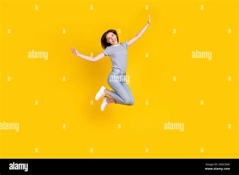 Full Length Photo Of Nice Young Girl Spread Hands Plane Jumping Ad