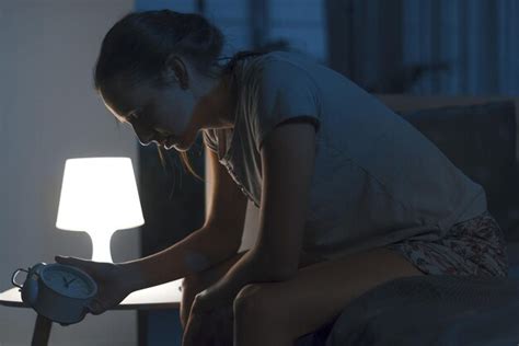 Premium Photo Sleepless Woman Awake At Night And Checking The Time