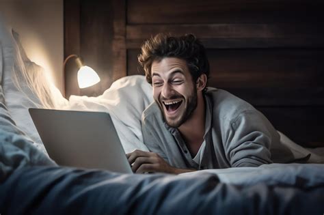 Premium AI Image A Man Is Using A Laptop In Bed And Laughing