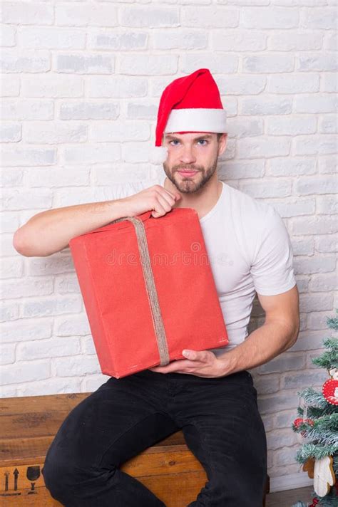 Macho In Christmas Hat Hold Wrapped Present Stock Image Image Of