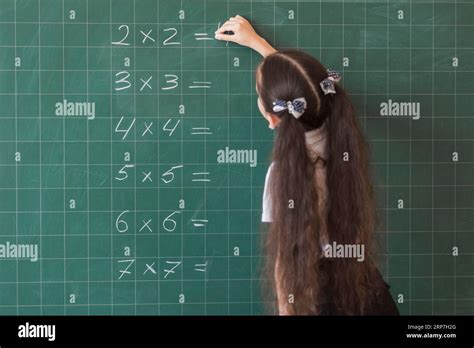Girl Making Calculations Blackboard Stock Photo Alamy