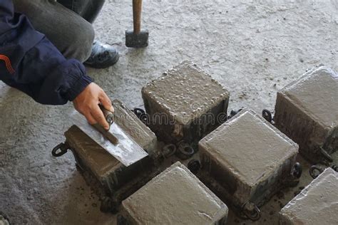 Cube Concrete Casting By Steel Mould And Worker Finishing Top Surface