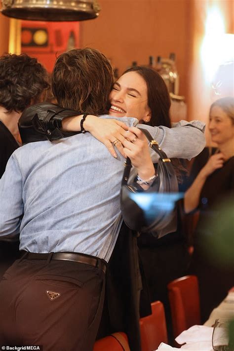 Smiling Lily James And Stranger Things Star Joe Keery Embrace As They