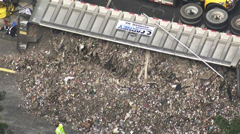 Tractor Trailer Rolls Over Dumping Trash On Ramp In Middleborough Abc6