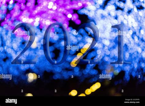 Text With The Year Number 2021 With A Background Of Bright Blue Lights