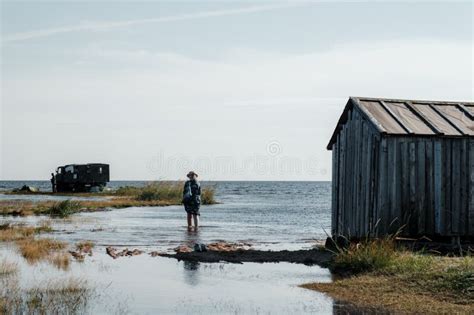 A Girl Walks On The Water During The White Sea Overflow Stock Image