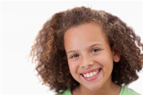 Premium Photo Close Up Of A Girl Smiling At The Camera