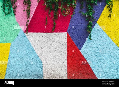 A Mesmerizing Abstract Background Adorns The Wall Vibrant Geometric Patterns Intertwining In A