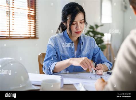 Concept Of Engineering Consulting Two Female Engineers Brainstorming