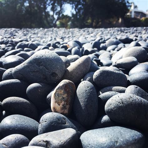 Premium Photo Close Up Of Pebbles On Beach