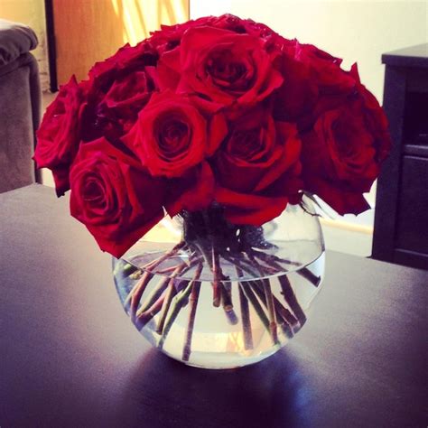Premium Photo Close Up Of Red Roses In Bowl On Table