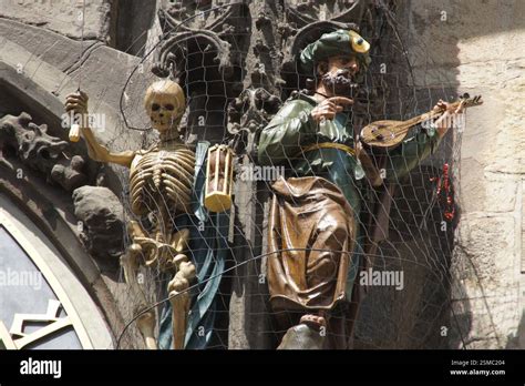 prague astronomical clock figures representing death and time