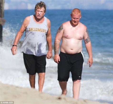 Ryan Oneal Bonds With Son Redmond On The Beach As They Toss Frisbee And Pick Up Litter Daily