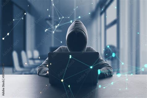 Hacker At Desktop Using Laptop With Glowing Polygonal Coding Mesh On
