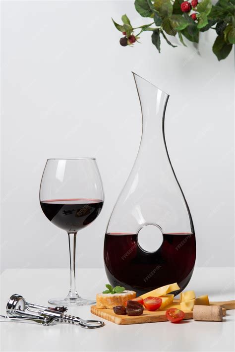 Free Photo Red Wine Carafe And Glass Arrangement