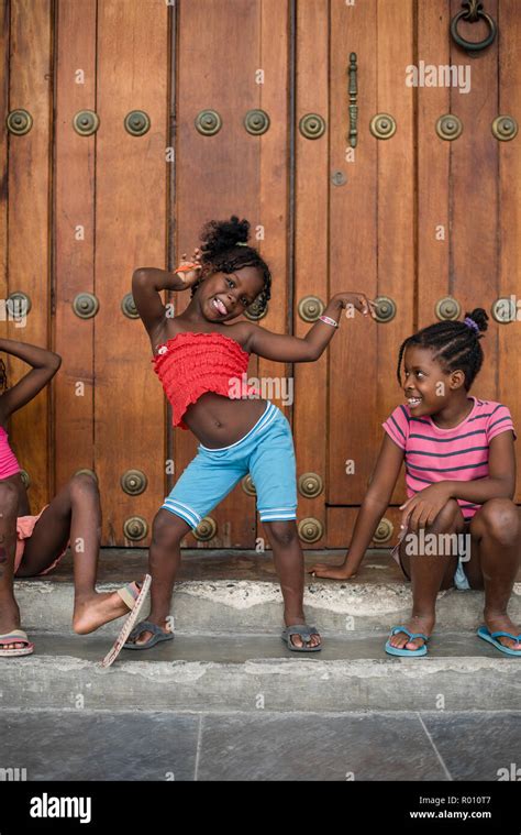Some Silly Girls Pose For The Camera In A Plaza In Havana Cuba Stock