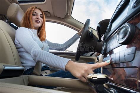 Young Redhead Woman Driver Fastened By Seatbelt Resting In A Car