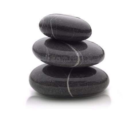 Three Beautiful Shiny Black River Stones Stacked On Top Of Each Other