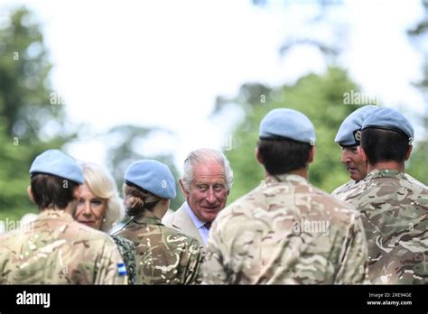 King Charles Iii And Queen Camilla Inspect The Guard Of Honour Of The