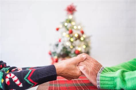 Premium Photo Senior Couple Holding Hands During Christmas