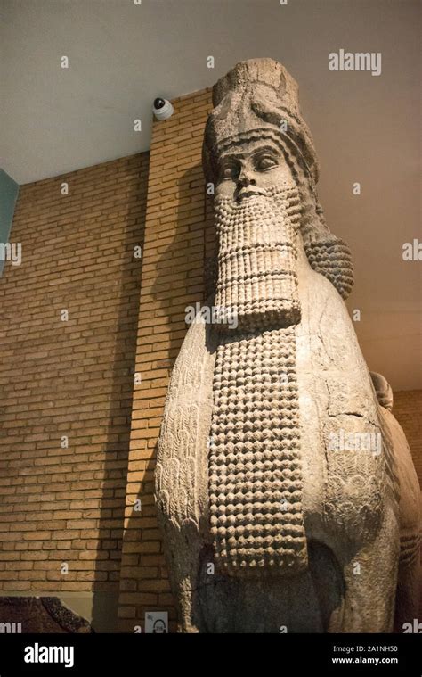 Colossal Assyrian Stone Sculpture Of A Human Headed Winged Bull From The Palace Of Khorsabad