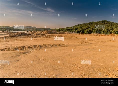 barren area of land that has been cleared for development with lush