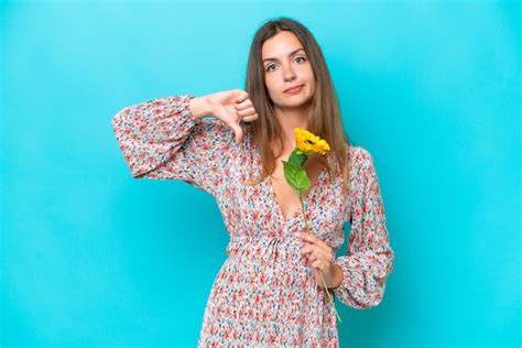 Premium Photo Young Caucasian Woman Holding Sunflower Isolated On