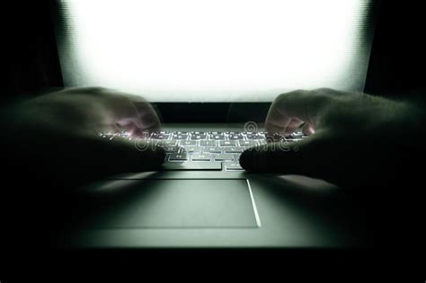 hacker using laptop lots of digits on the computer screen stock image