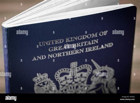 Stock Image New Issue Blue And Gold British Passport Of The United