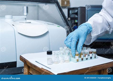 Scientist Women Check Sample In Vials For Analysis By Fourier Transform