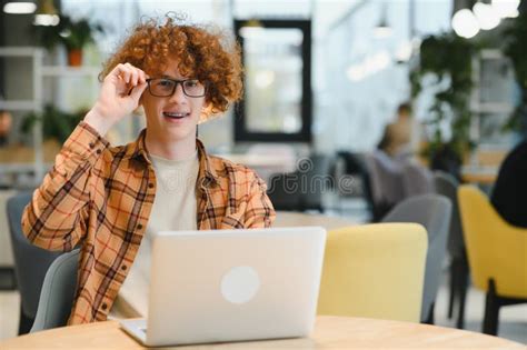 Male Programmer Wear Spectacles For Eyes Protection While Working On Freelance Via Laptop