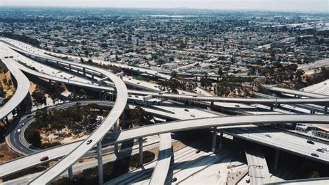 Drone Flying Left High Above Big Judge Pregerson Freeway Junction In Los Angeles With Multiple